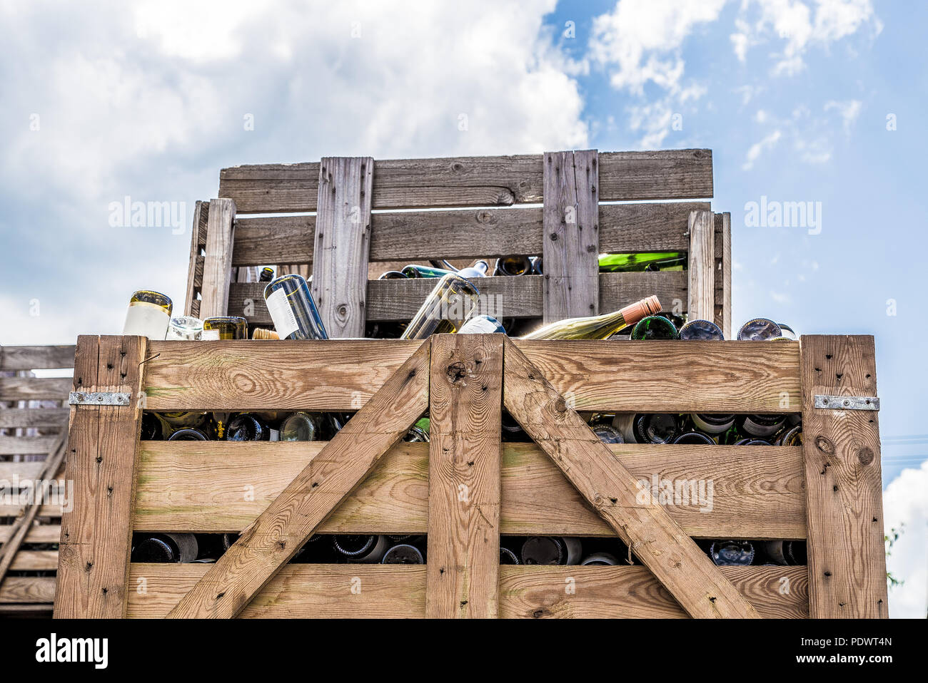 Empty wine bottles stacked in wine boxes Stock Photo - Alamy