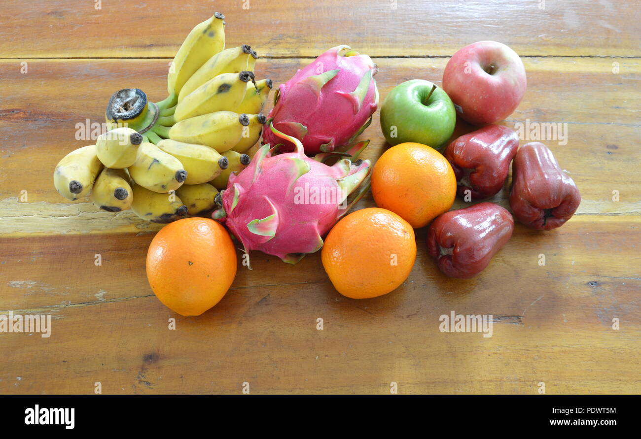 tropical fruits on wood table Stock Photo - Alamy