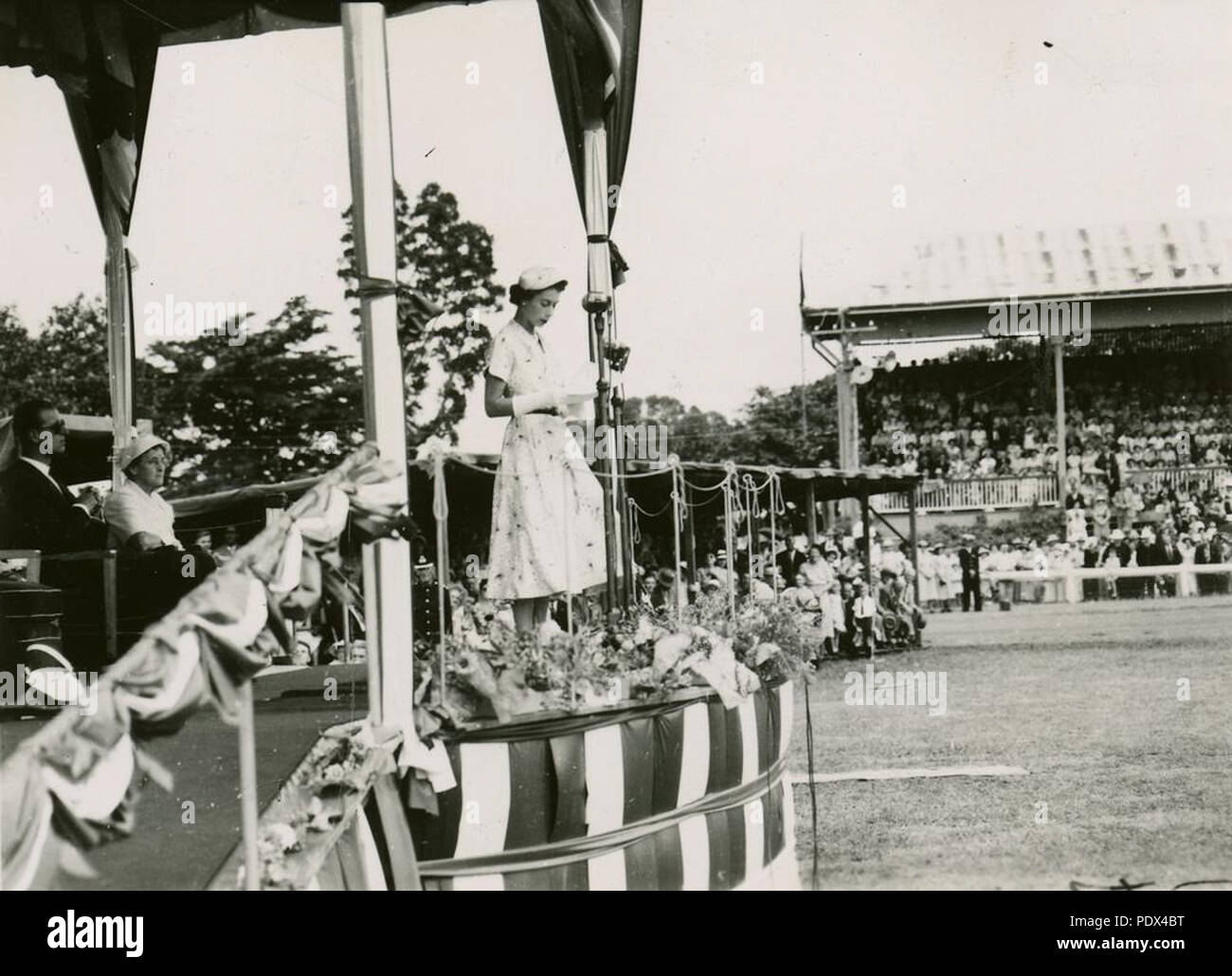 253 StateLibQld 1 233849 Queen Elizabeth II addressing the crowds in ...