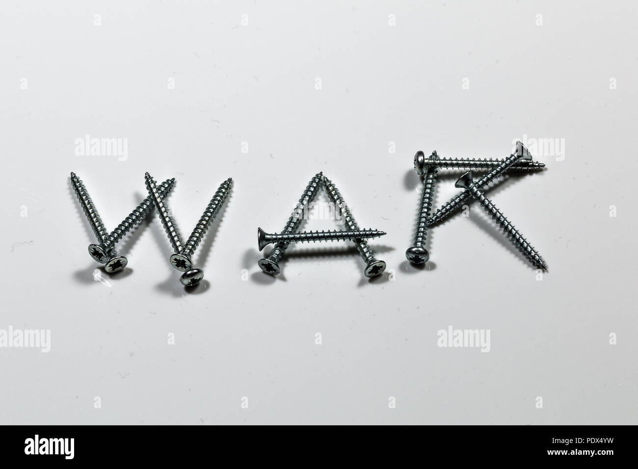The word WAR written with screws on white background Stock Photo - Alamy