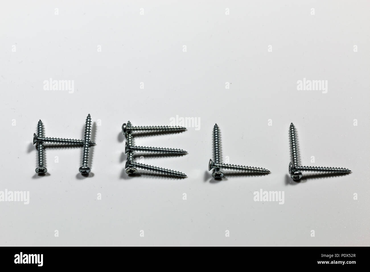 The word HELL written with screws on white background Stock Photo - Alamy