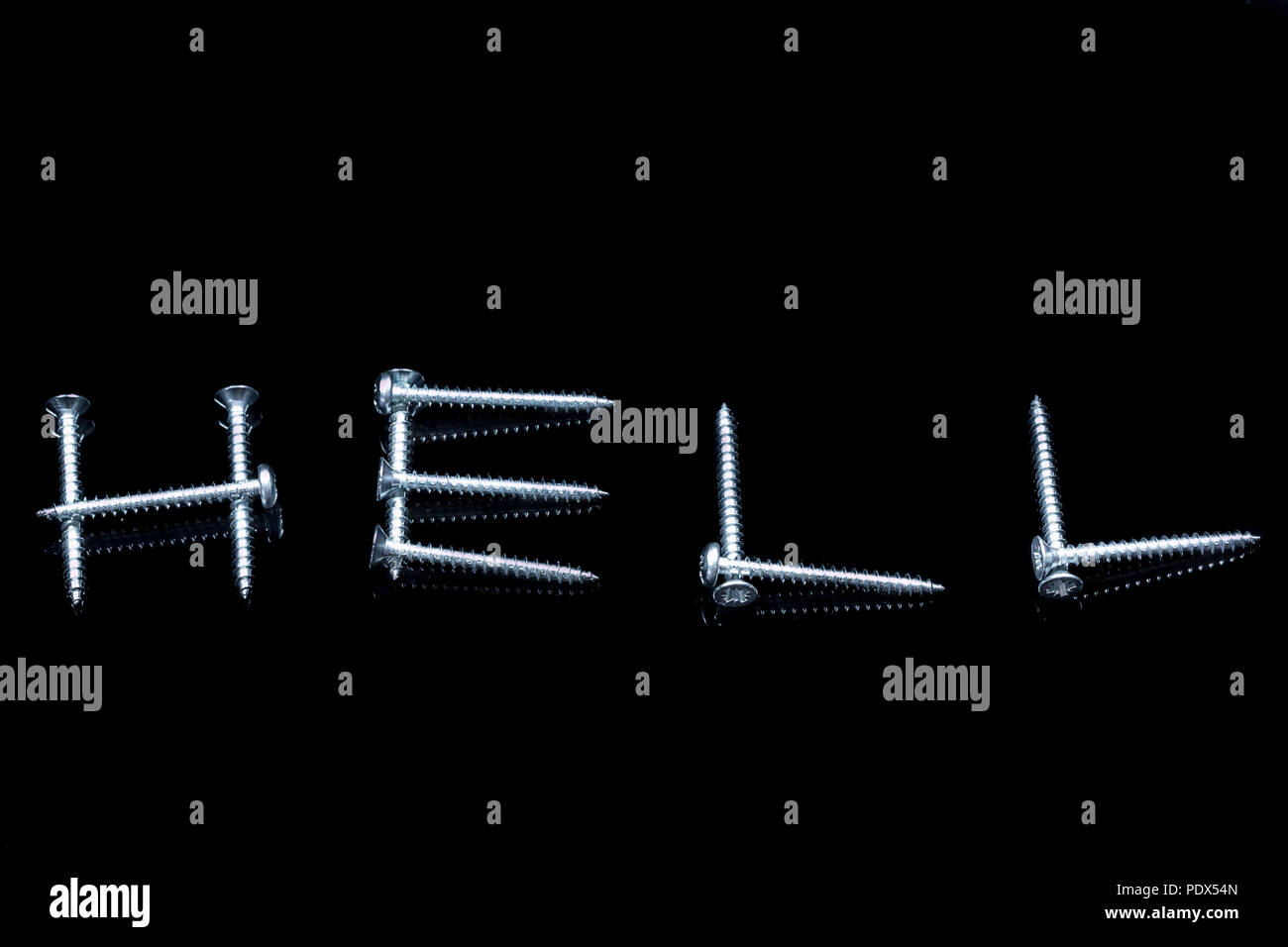 The word HELL written with screws on black background Stock Photo - Alamy