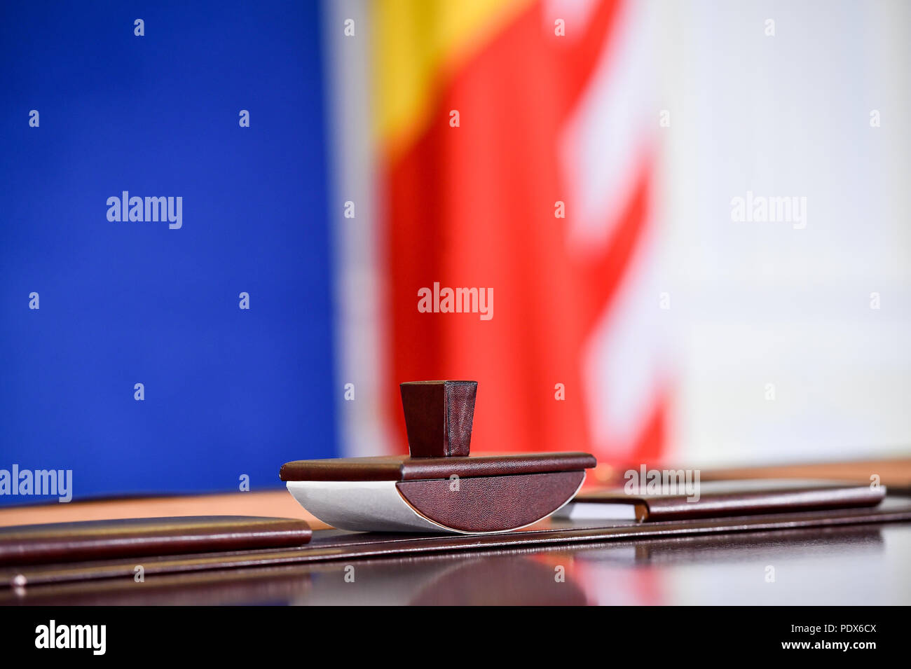 Concept shot with a stamp and flags in the background after treaty sign ...