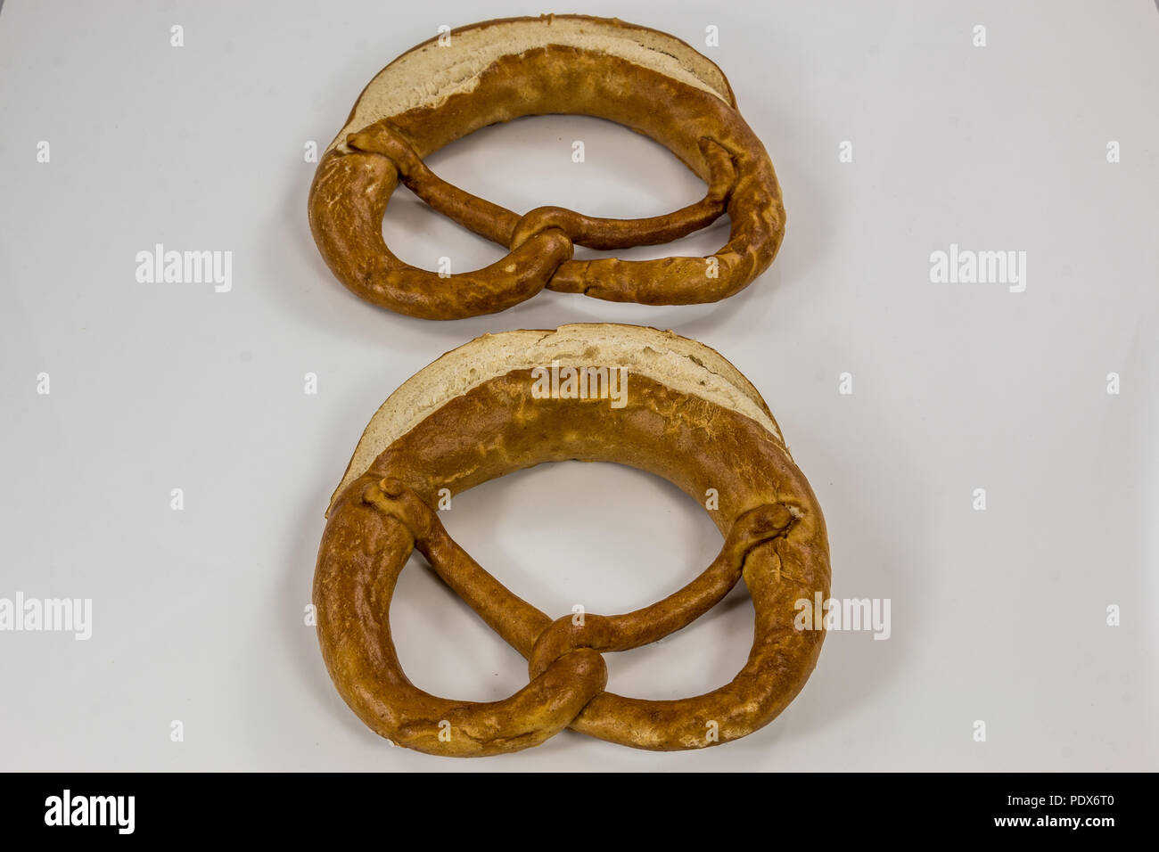 Old German pretzels on white background Stock Photo - Alamy