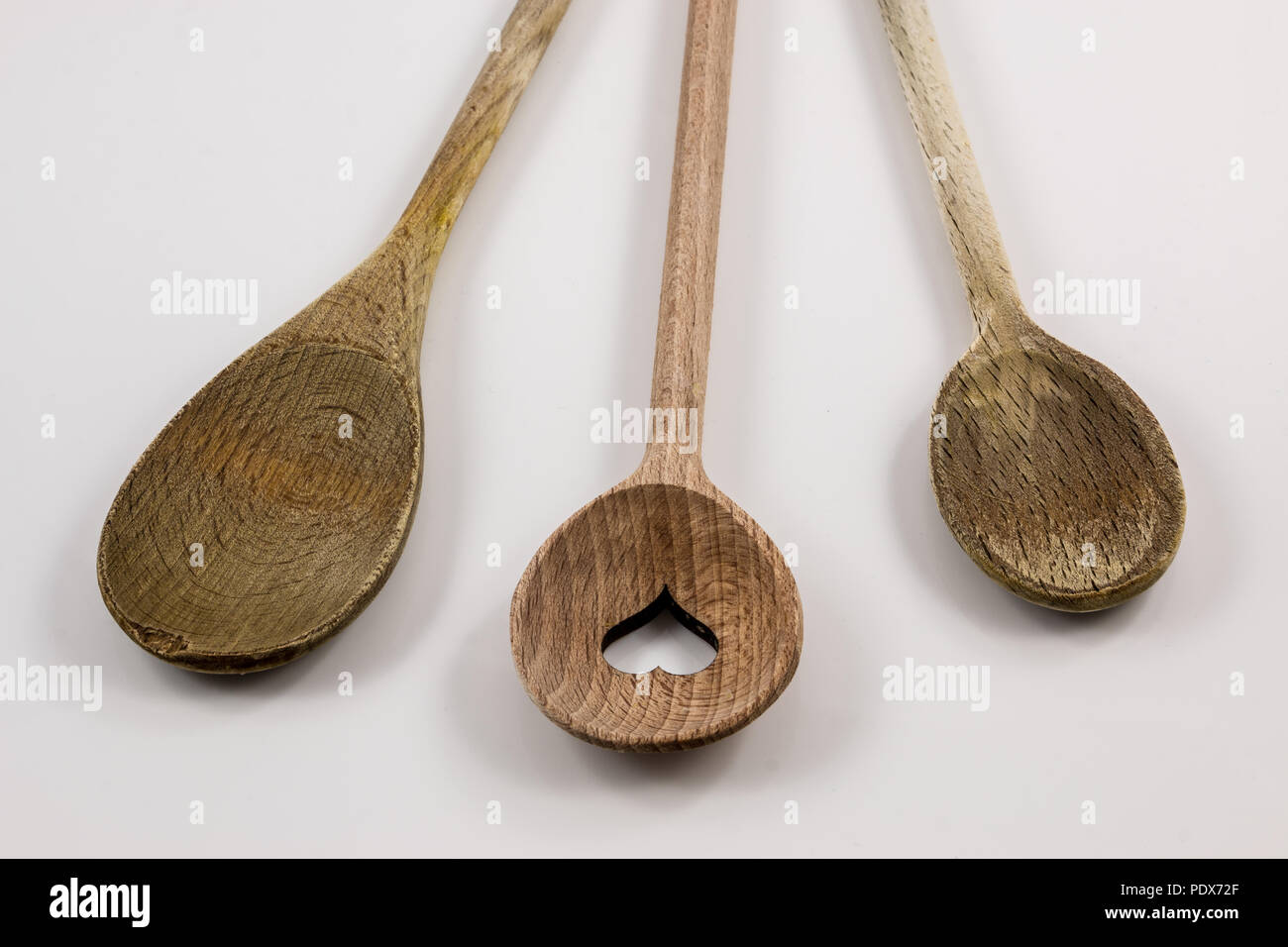 Wooden spoons in the kitchen on white background Stock Photo - Alamy