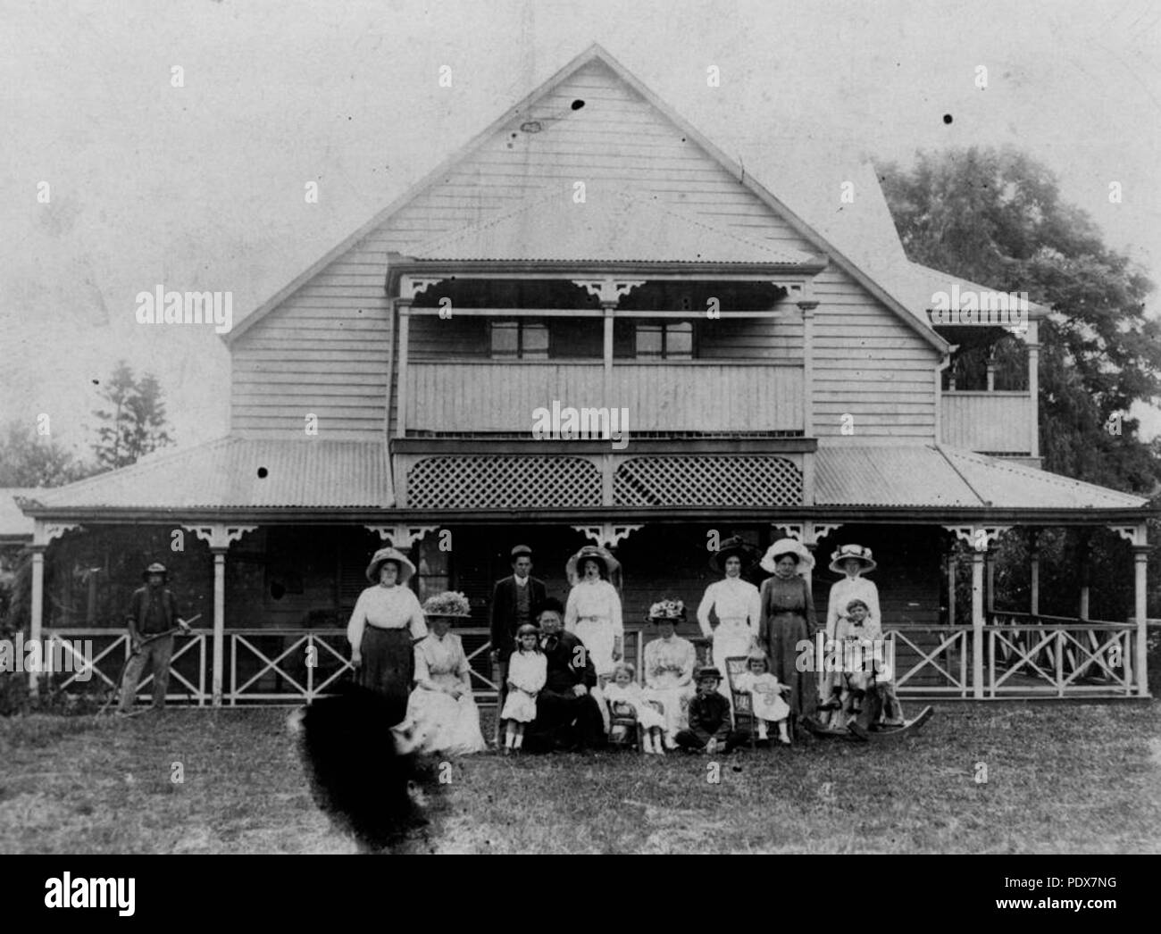 267 StateLibQld 1 47164 Family gathering photographed in front of Woodville, Ipswich, ca. 1900 ...