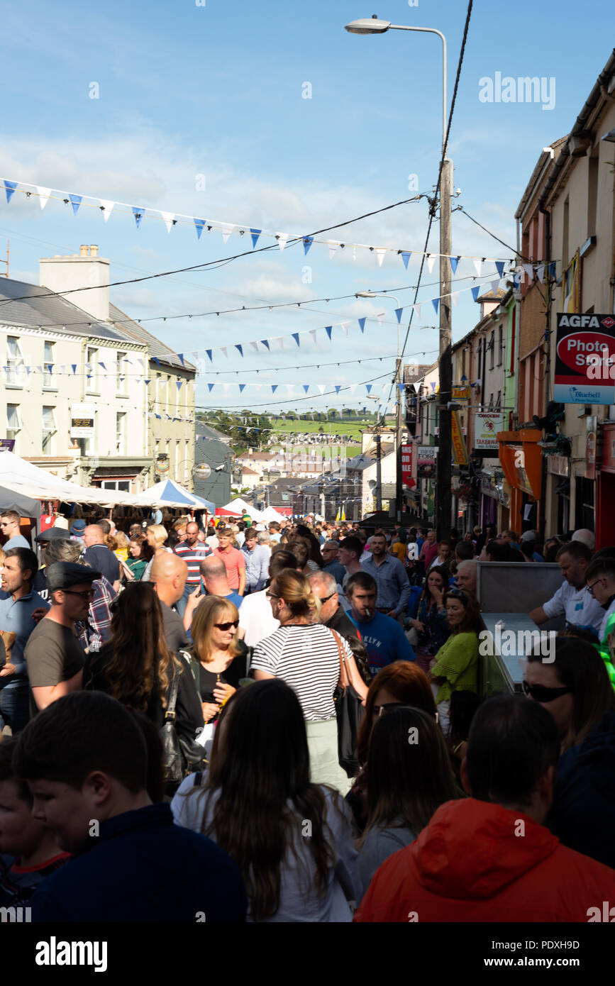 Irish summer festival fair. People on streets during the Puck Fair ...