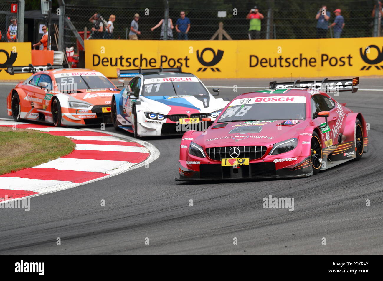 DTM driver Eduardo Mortara battling hard in his Mercedes at Brands Hatch. Credit: Uwe Deffner ...