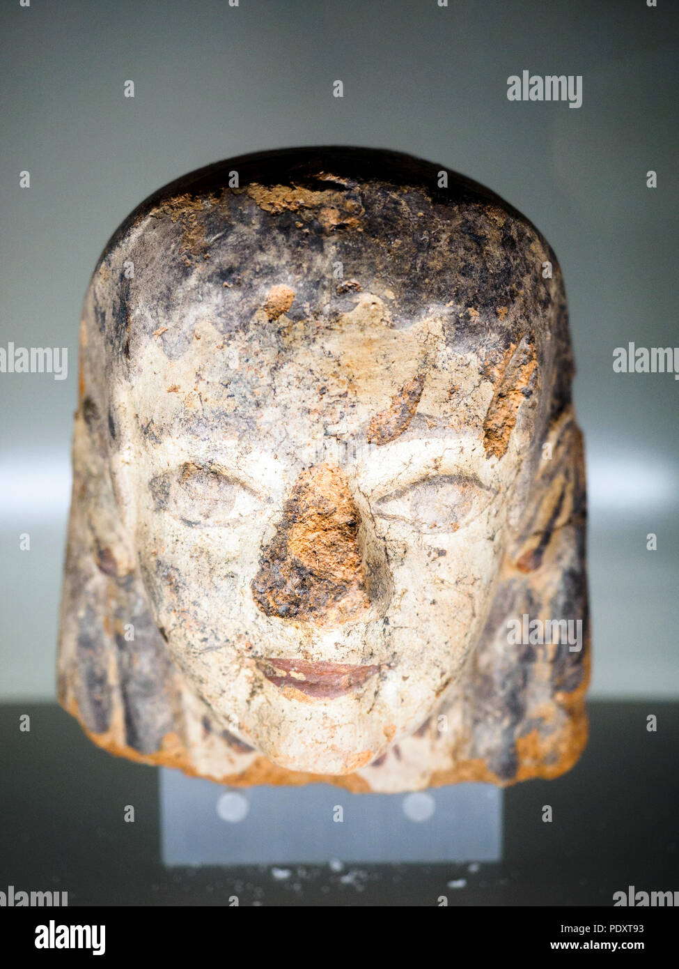 Terracotta antefix in female head with face with long eyes to hair with ...