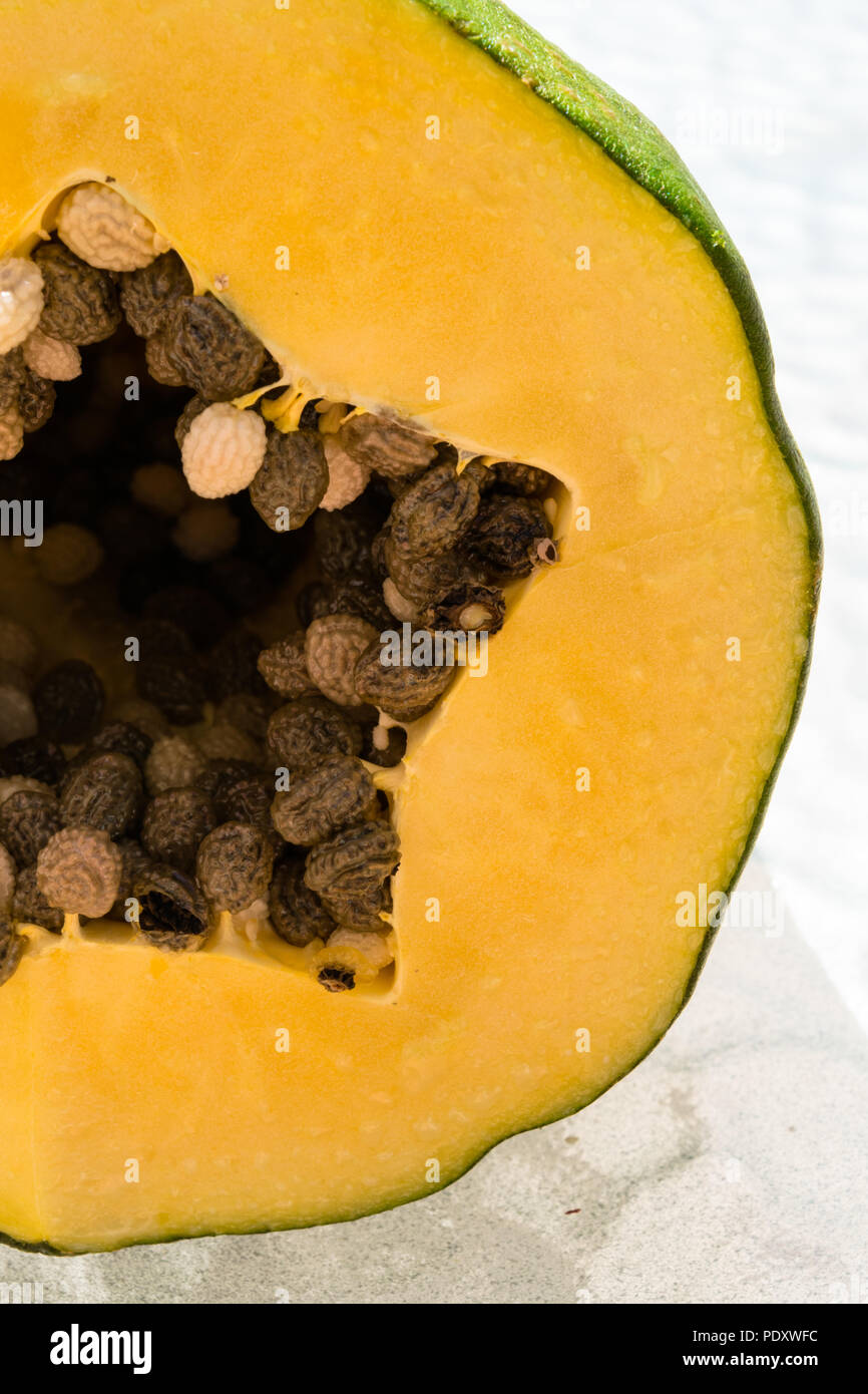 raw delicious halved papaya fruit with star of pit Stock Photo - Alamy