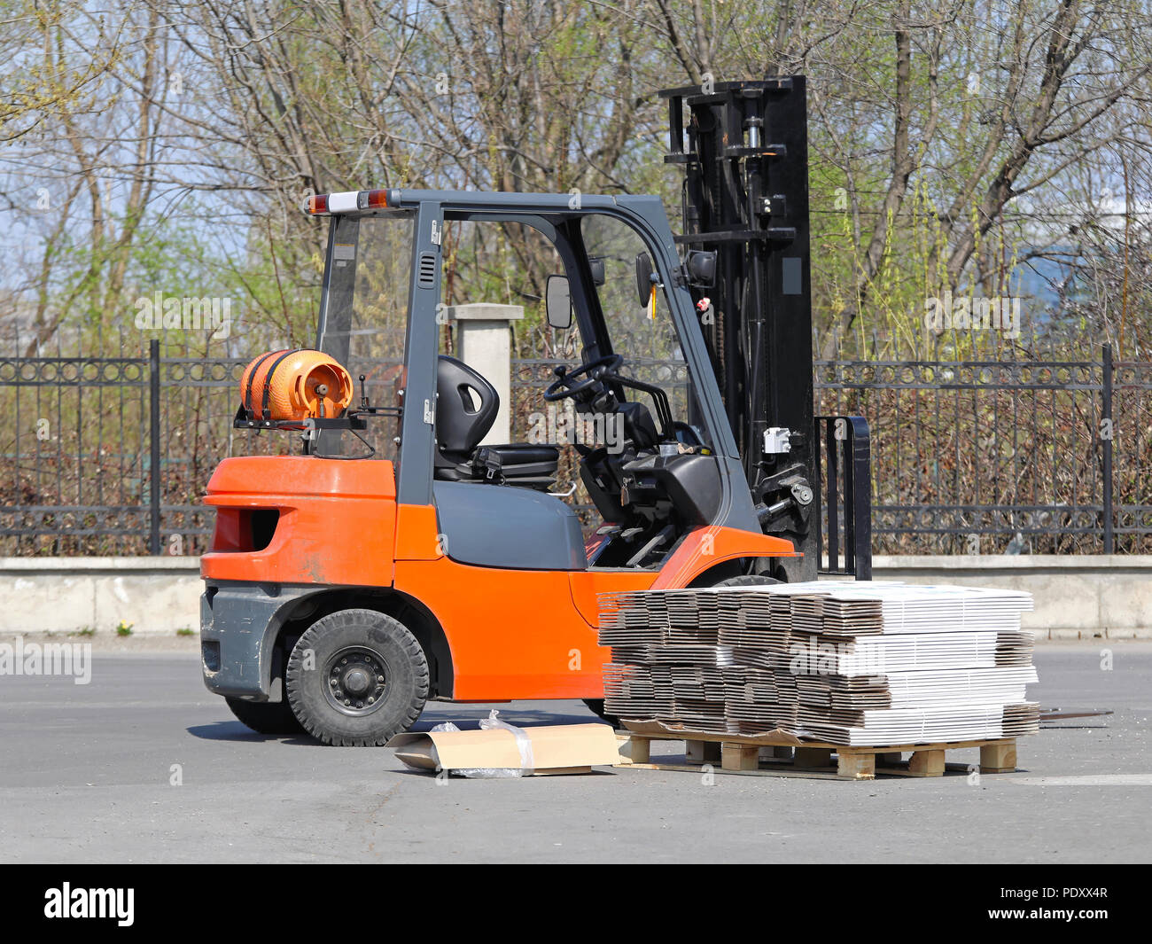 Gas powered forklift and pallet with package Stock Photo - Alamy