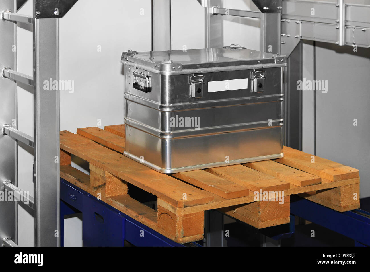 Metal transportation box at logistic pallet Stock Photo - Alamy