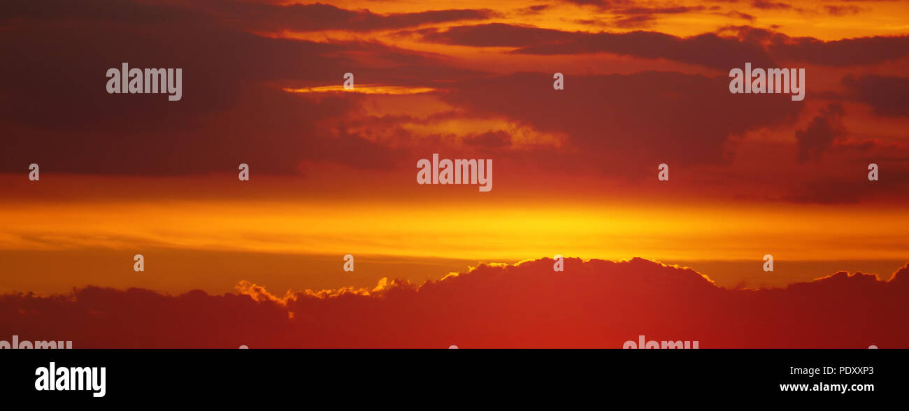 Epic sunset in the sky. Wide background Stock Photo - Alamy