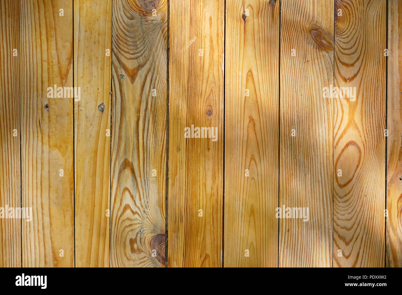 Wooden surface of boards illuminated by light rays. Copy space Stock ...