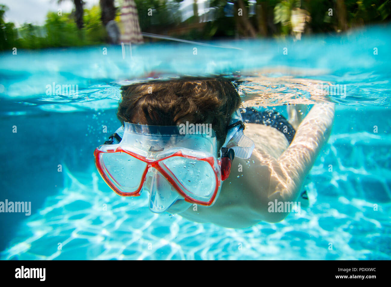 Person underwater in pool hi-res stock photography and images - Alamy