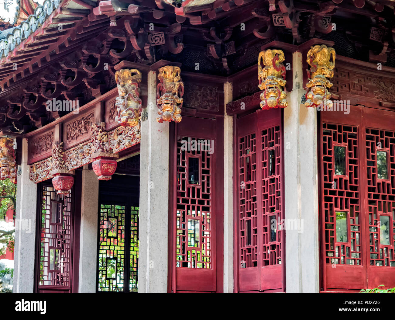 Traditional chinese building with ornate roof and red windows at Yu ...