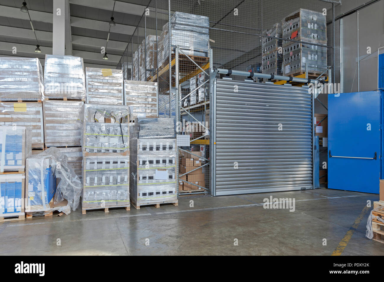 Secure storage room in distribution warehouse Stock Photo - Alamy