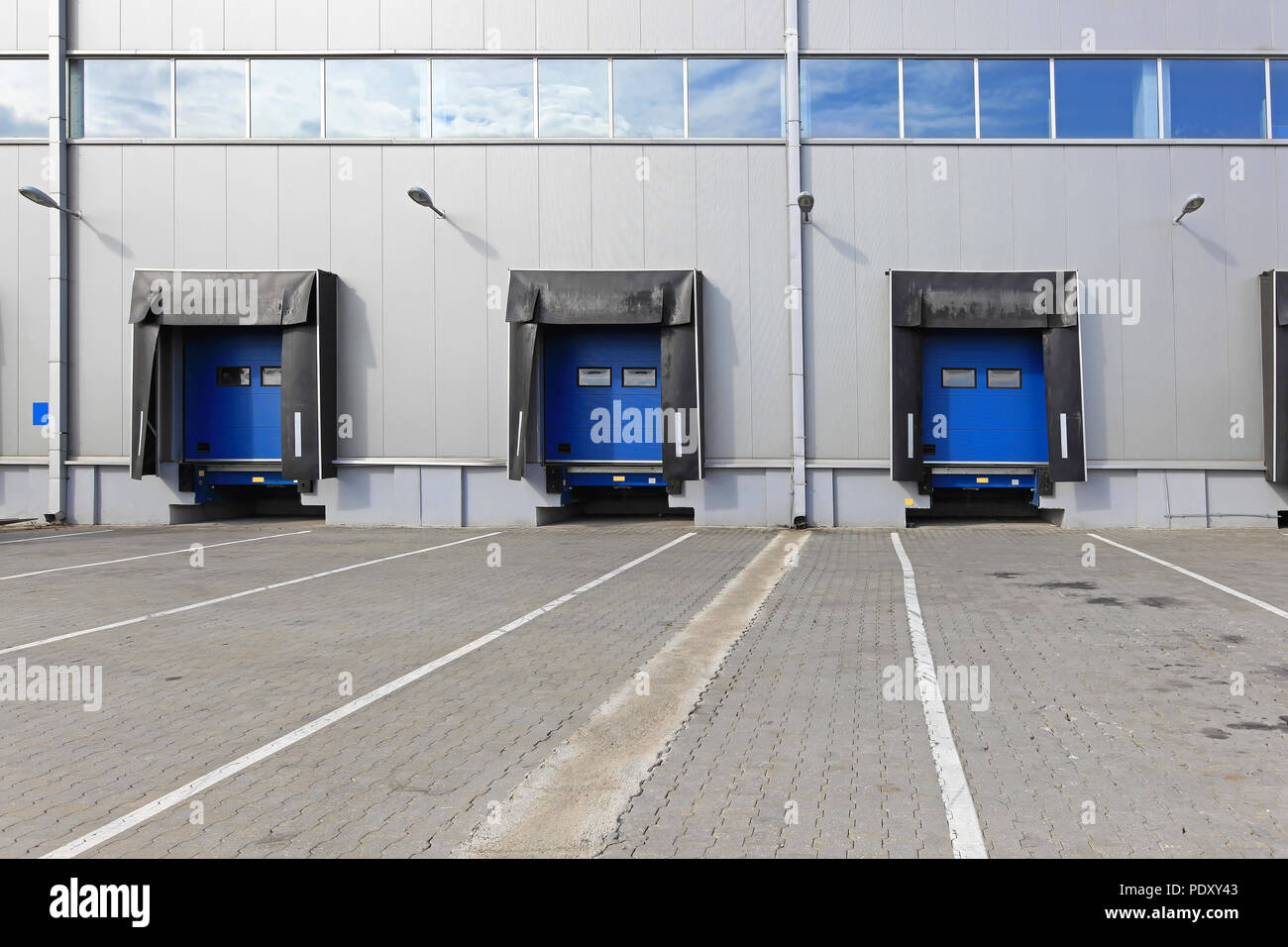 Loading dock ramps at distribution warehouse Stock Photo - Alamy
