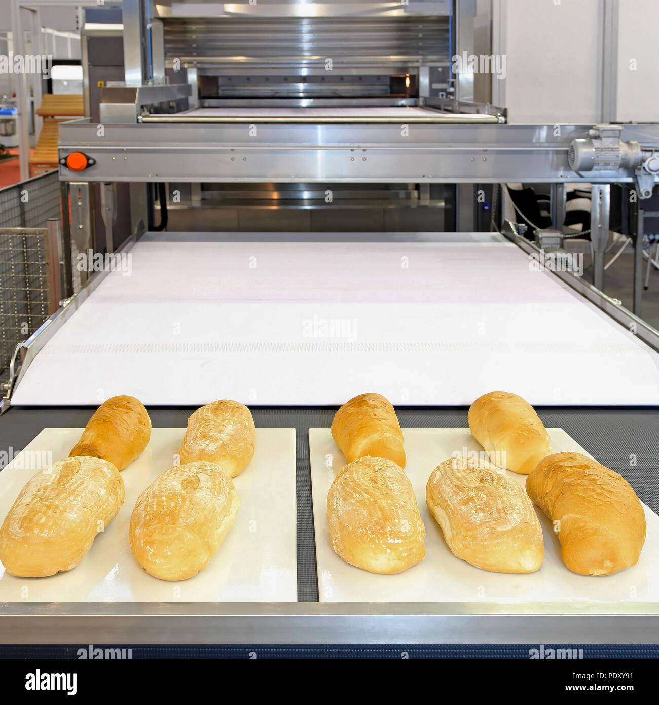 Automated bread production line in bakery Stock Photo - Alamy