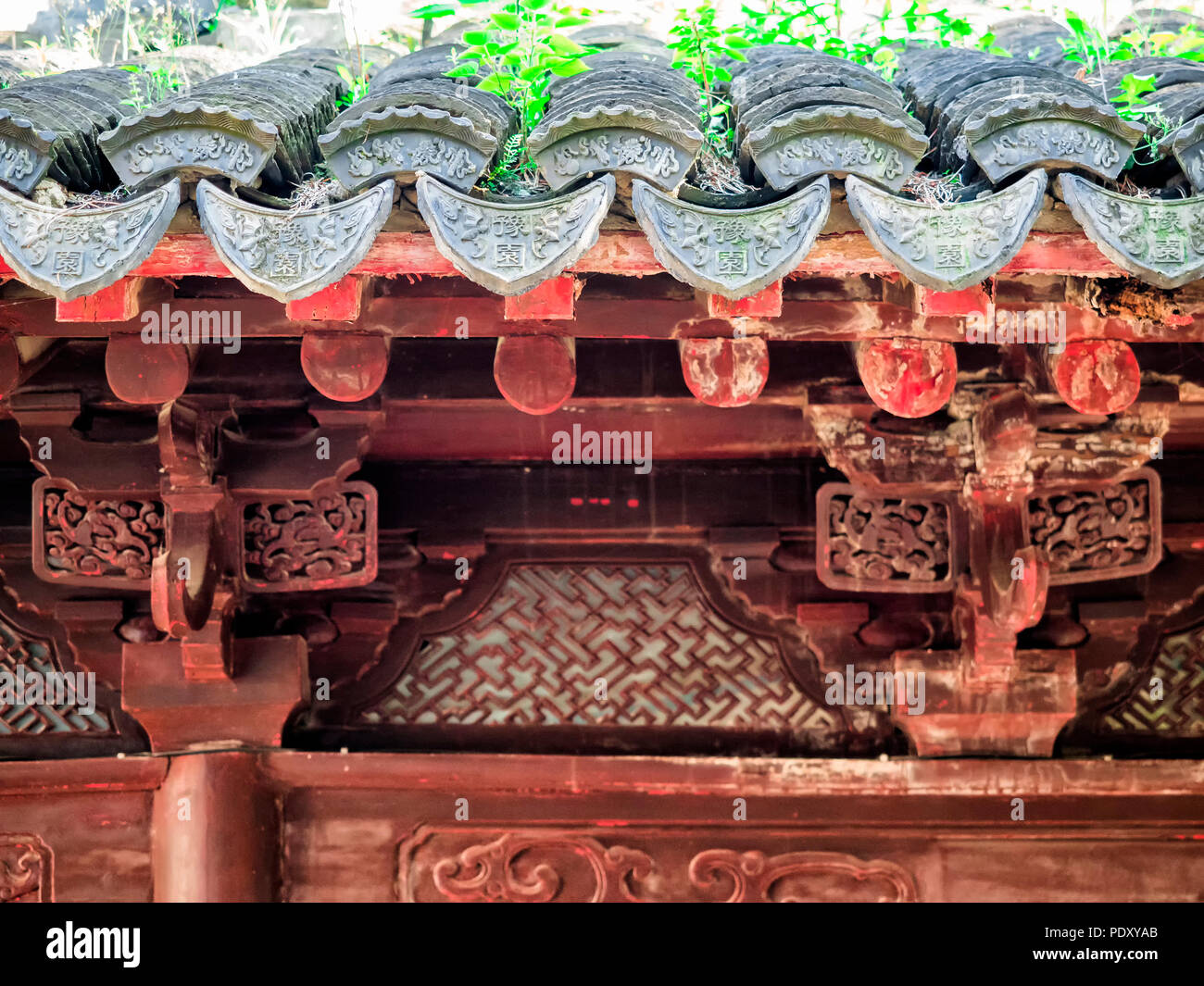 Traditional chinese building with ornate roof and red windows at Yu ...