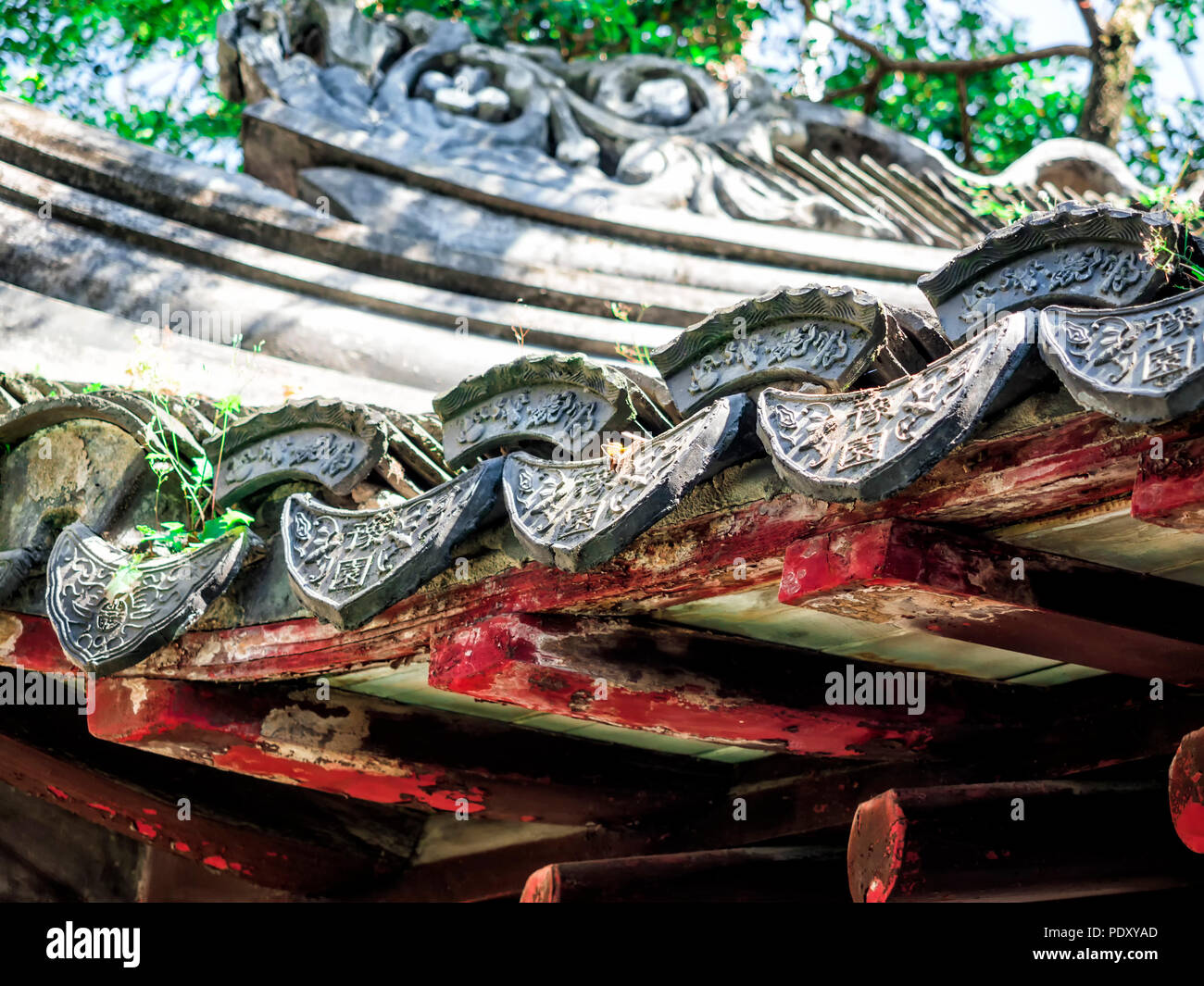 Traditional chinese building with ornate roof and red windows at Yu ...