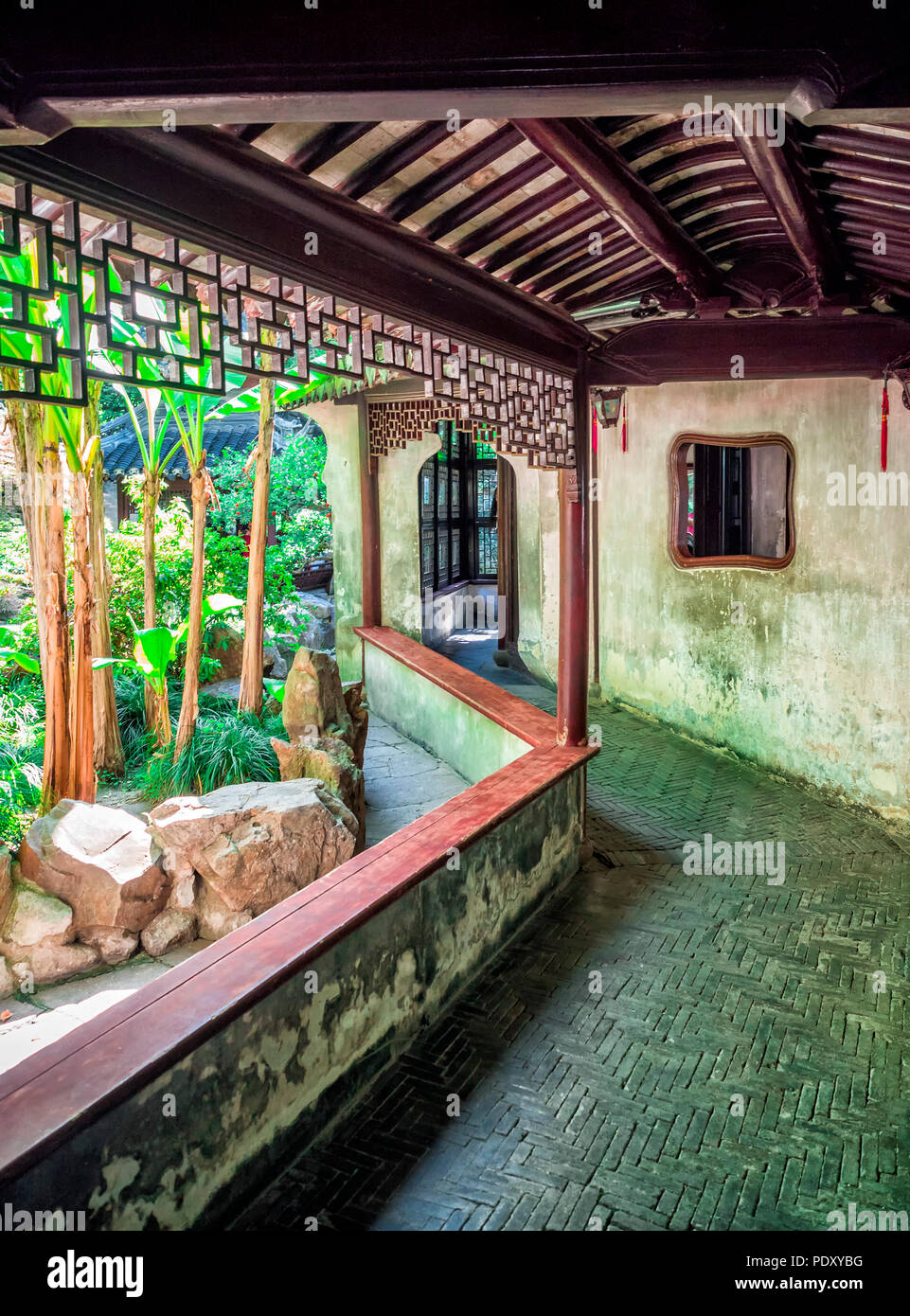 Traditional chinese building with ornate roof and red windows at Yu ...