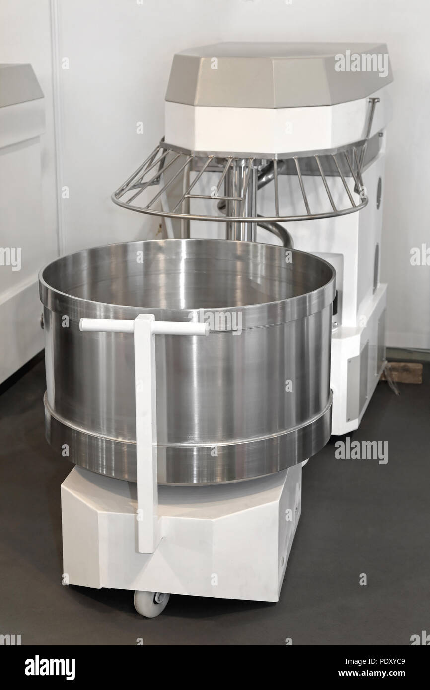 Dough mixer with big bucket in bakery Stock Photo - Alamy