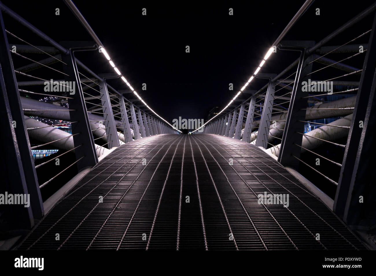 Small pedestrian bridge at night in False Creek, Vancouver Stock Photo ...