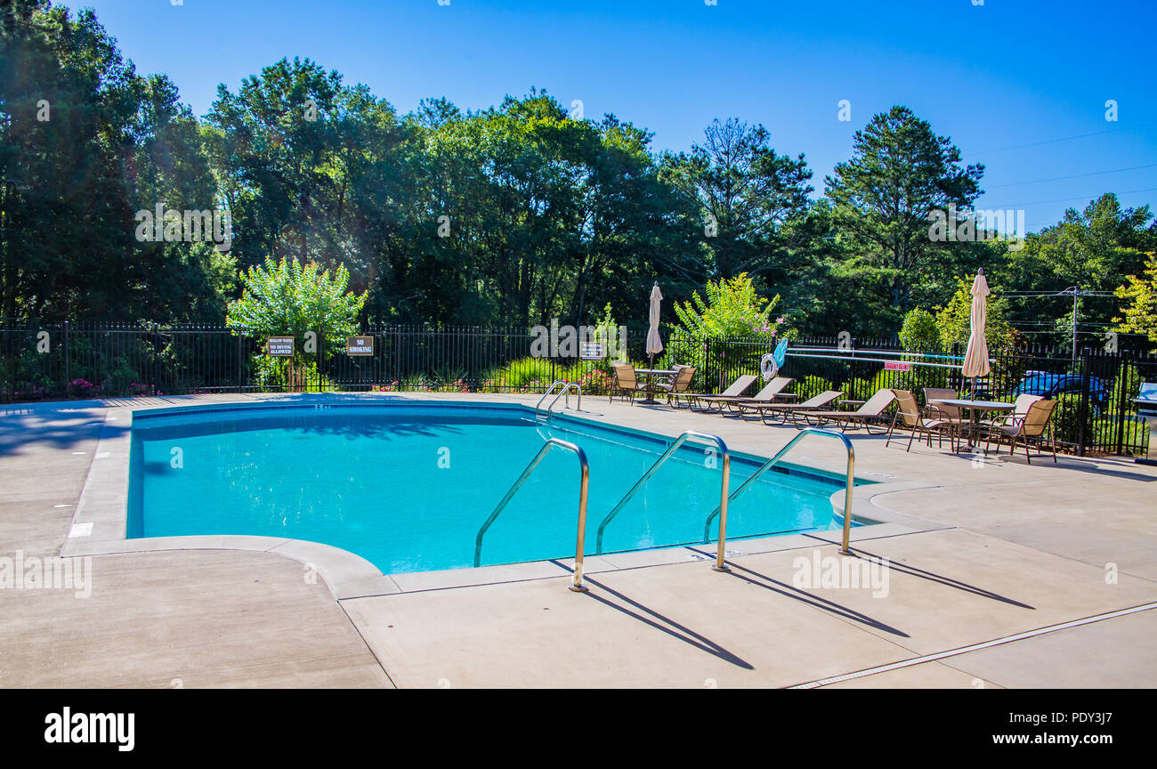 Small Blue Swimming Pool with Concrete Deck Stock Photo - Alamy