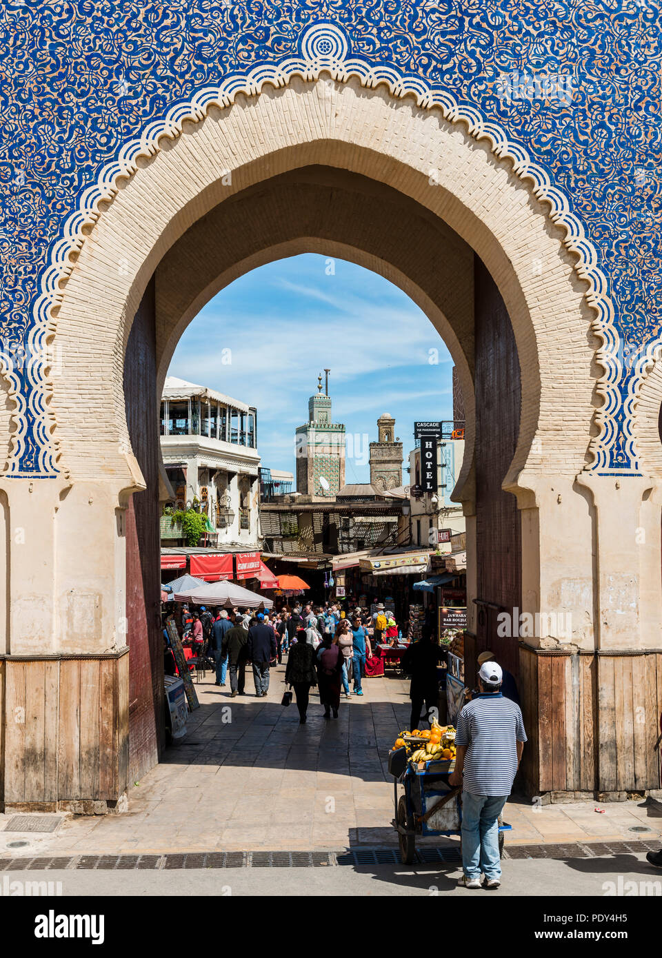 Locals in front of Bab Boujeloud, Blue Gate of Fes, Minaret of the ...