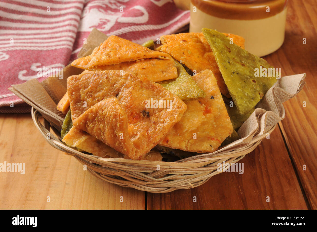 Fried vegetable infused tortilla chips in a basket Stock Photo - Alamy
