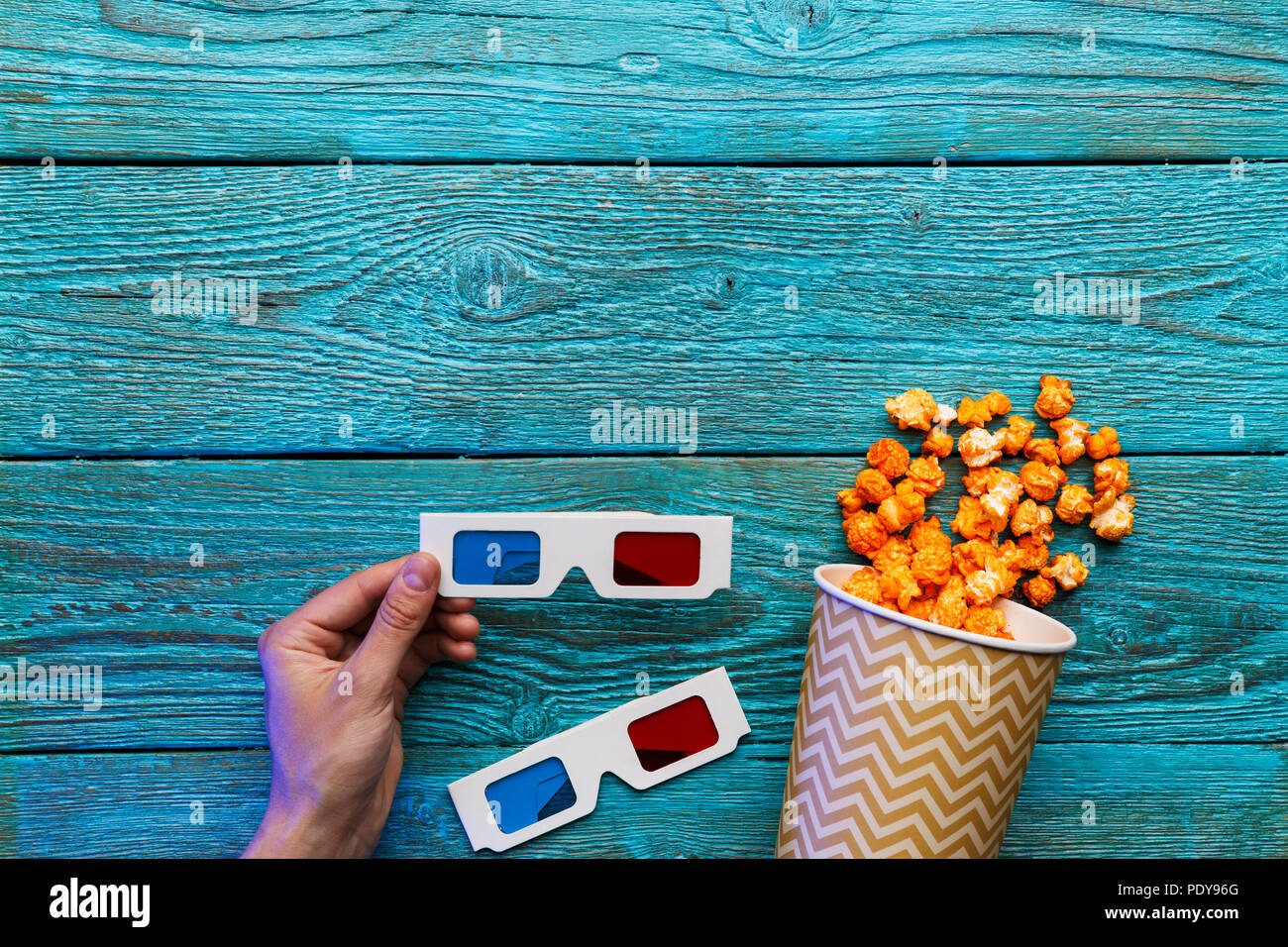 Popcorn cinema hands hi-res stock photography and images - Alamy