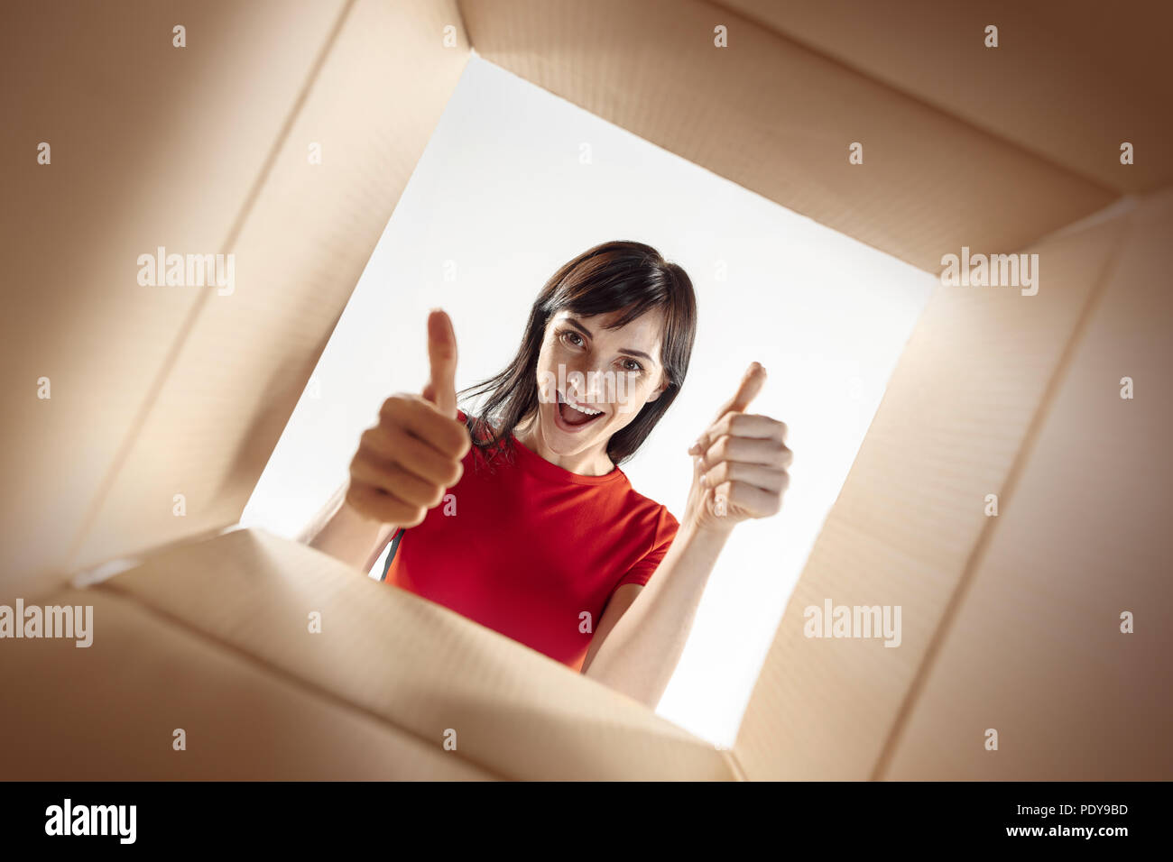 Woman inside cardboard box hi-res stock photography and images - Alamy