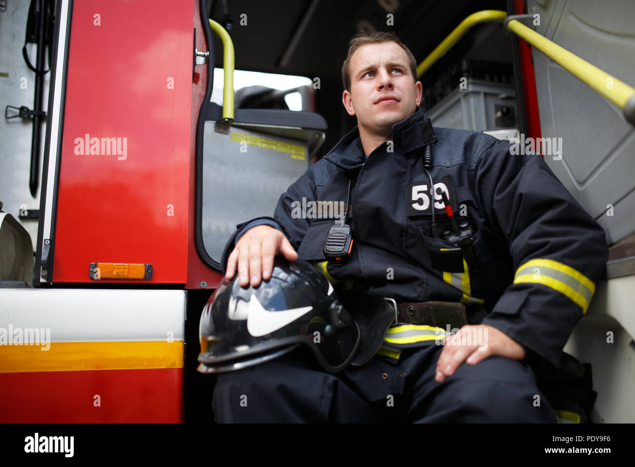 Man fire extinguisher in firefighting hi-res stock photography and ...