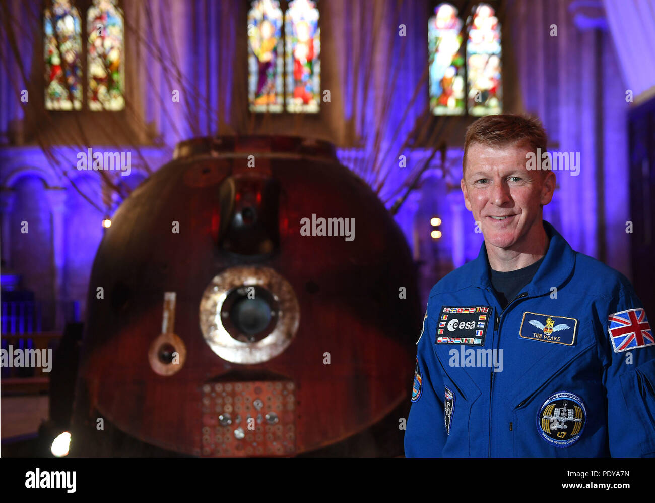 Major Tim Peake with the Soyuz descent module, the spacecraft which ...