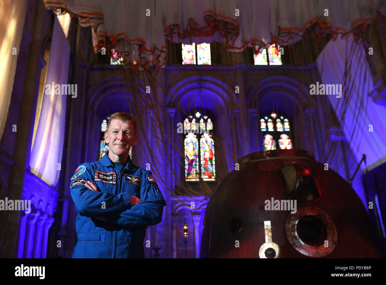 Major Tim Peake with the Soyuz descent module, the spacecraft which ...