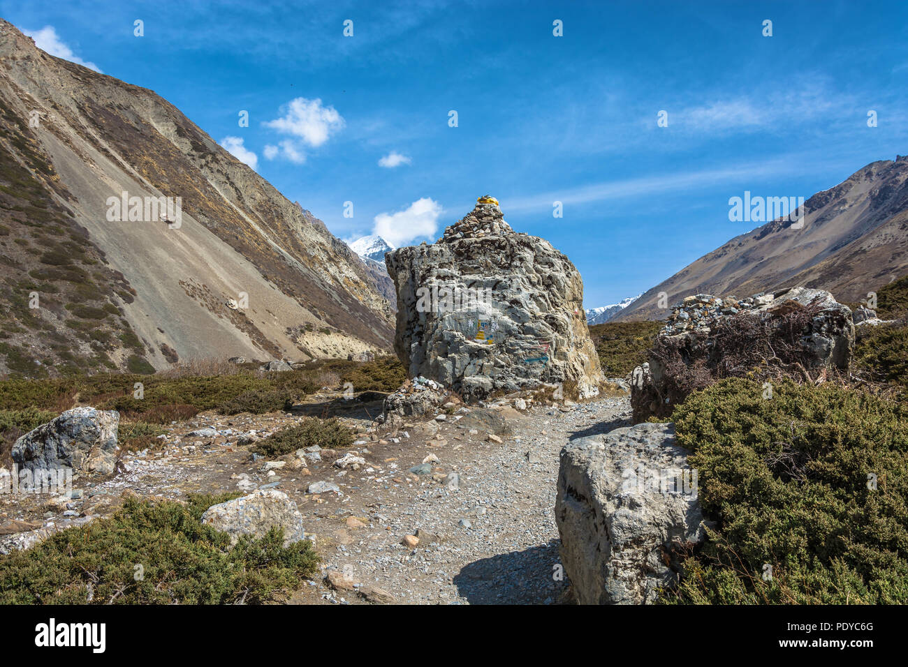 Mountain trail among the big stones in the Himalayas on a spring Sunny ...