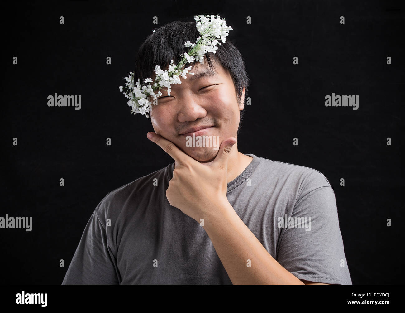 Man wearing flower garlands hi-res stock photography and images - Alamy