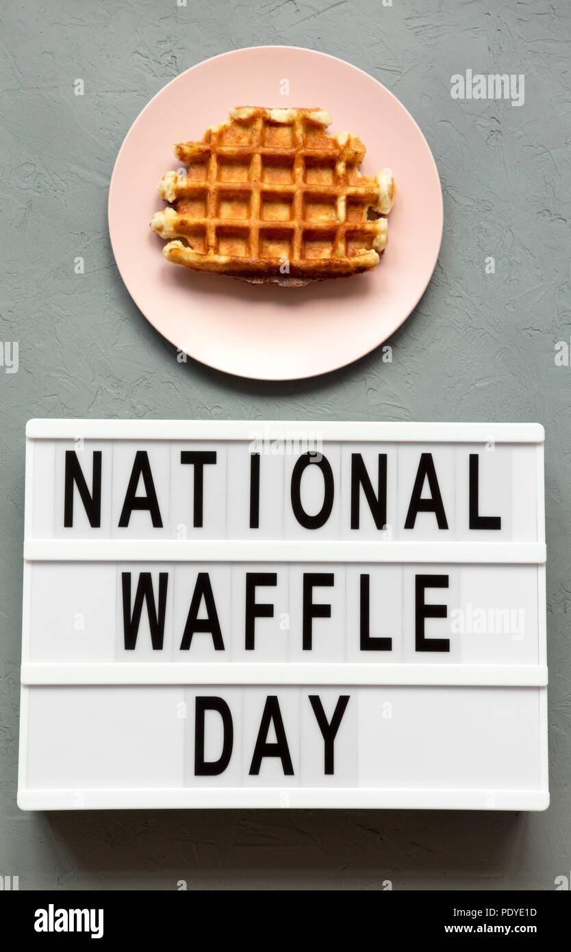 'National Waffle Day' word on lightbox, traditional belgian waffle on ...