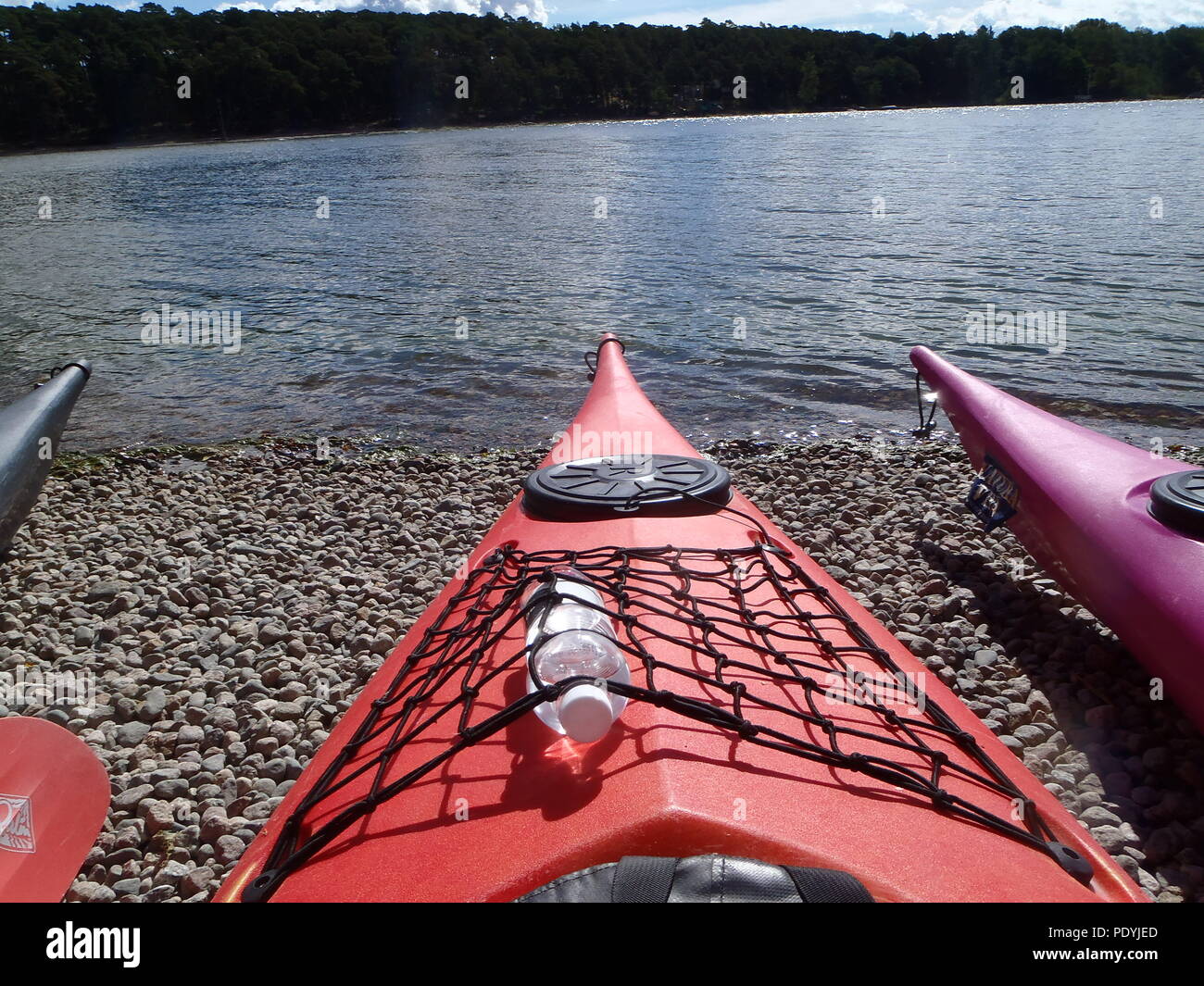 A Red Kayak on a Beach of the Gulf of Finnland Stock Photo - Alamy