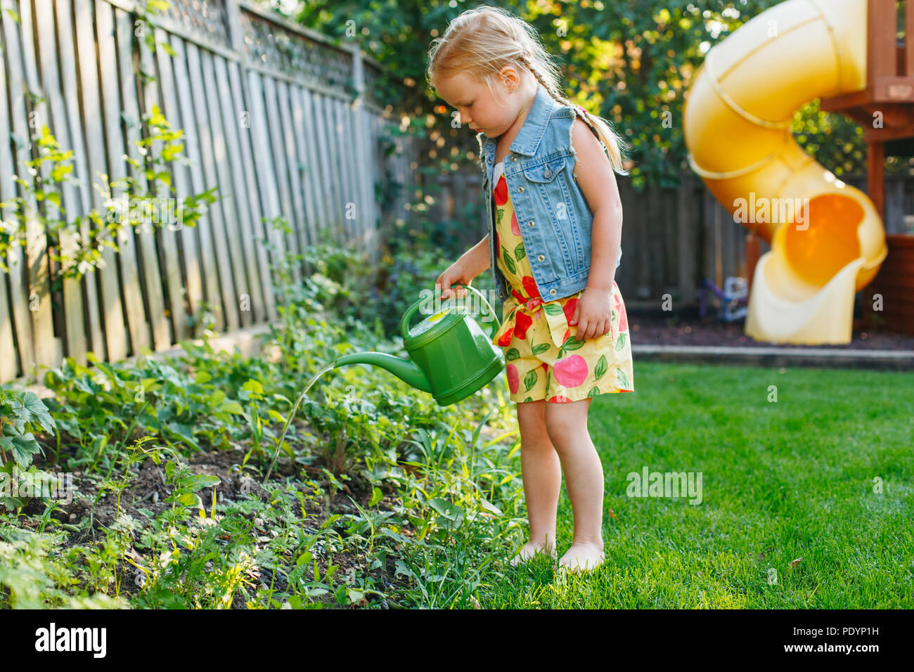 Kids Watering Flowers