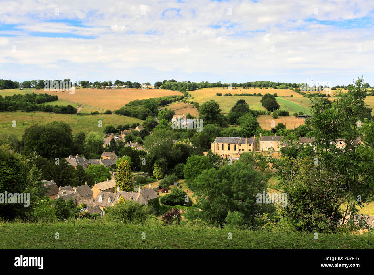 The Stone built Cottages of Naunton village, nestling in the river ...
