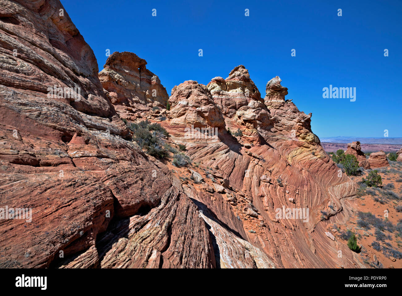 AZ00243-00..ARAZONA - Layered sandstone buttes topped with eroded ...