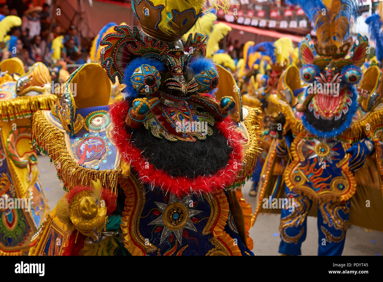 Morenada dancers in ornate costumes parade through the mining city of ...
