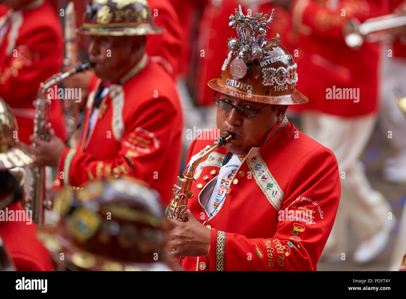 Band of a Morenada dance group in colourful outfits parading through ...