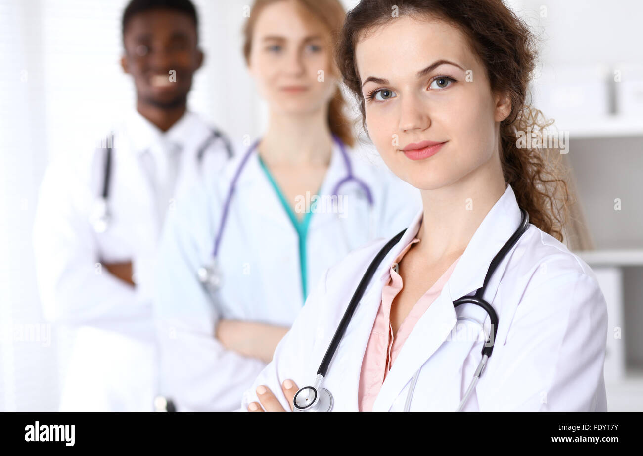 Happy doctor woman with medical staff at the hospital Stock Photo - Alamy