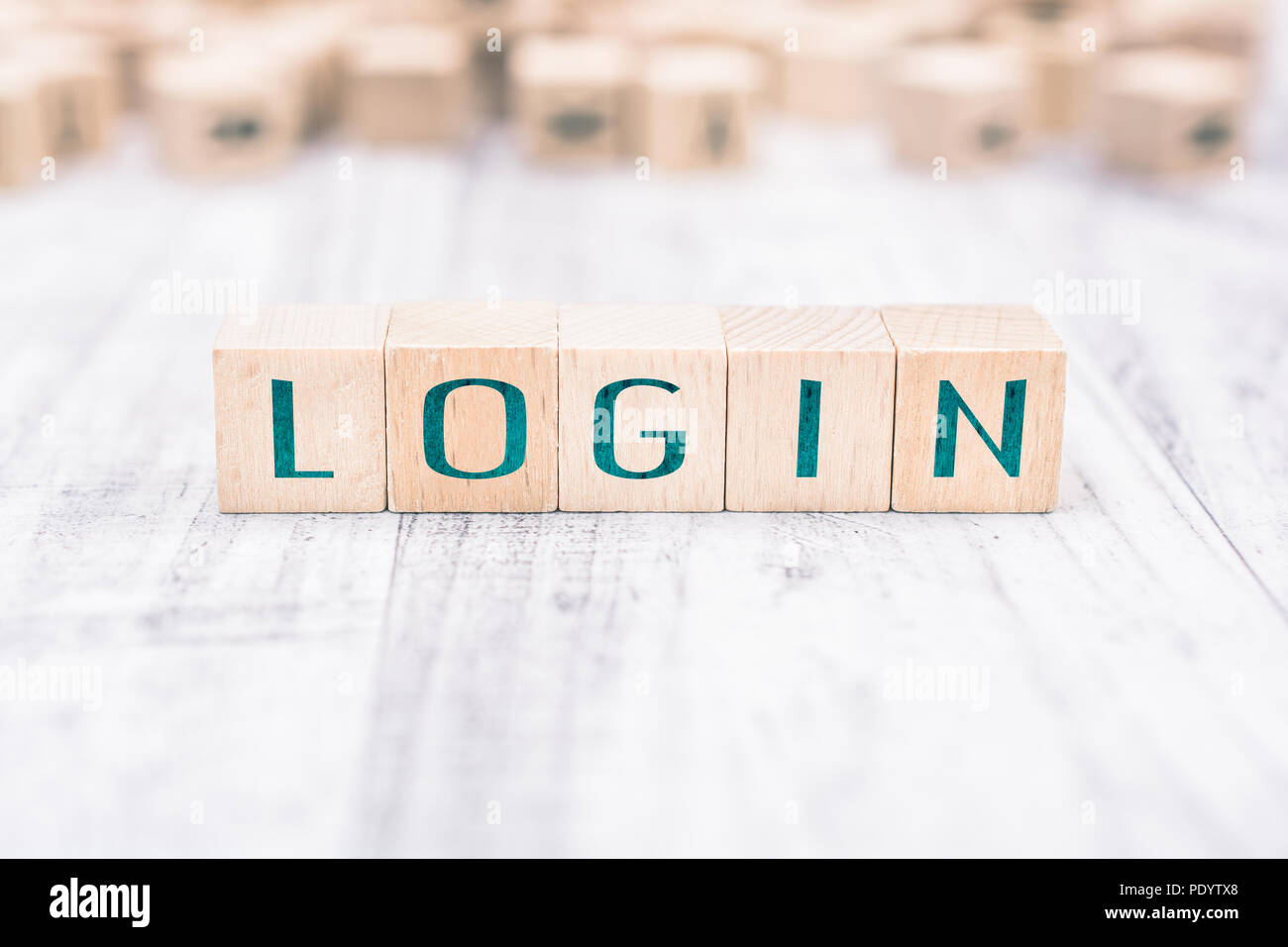 The Word Login Formed By Wooden Blocks On A White Table Stock Photo - Alamy