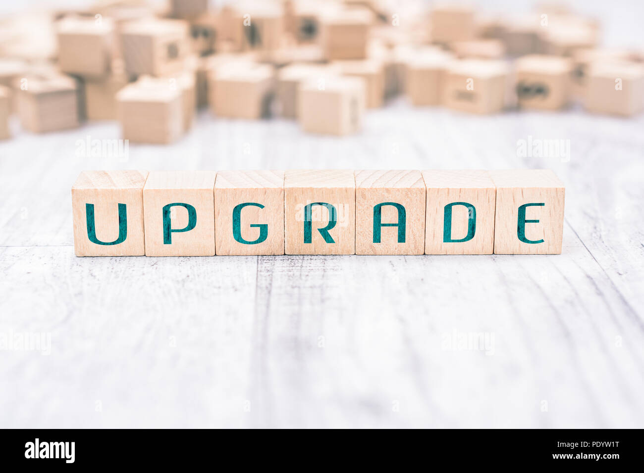 The Word Upgrade Formed By Wooden Blocks On A White Table, Reminder ...