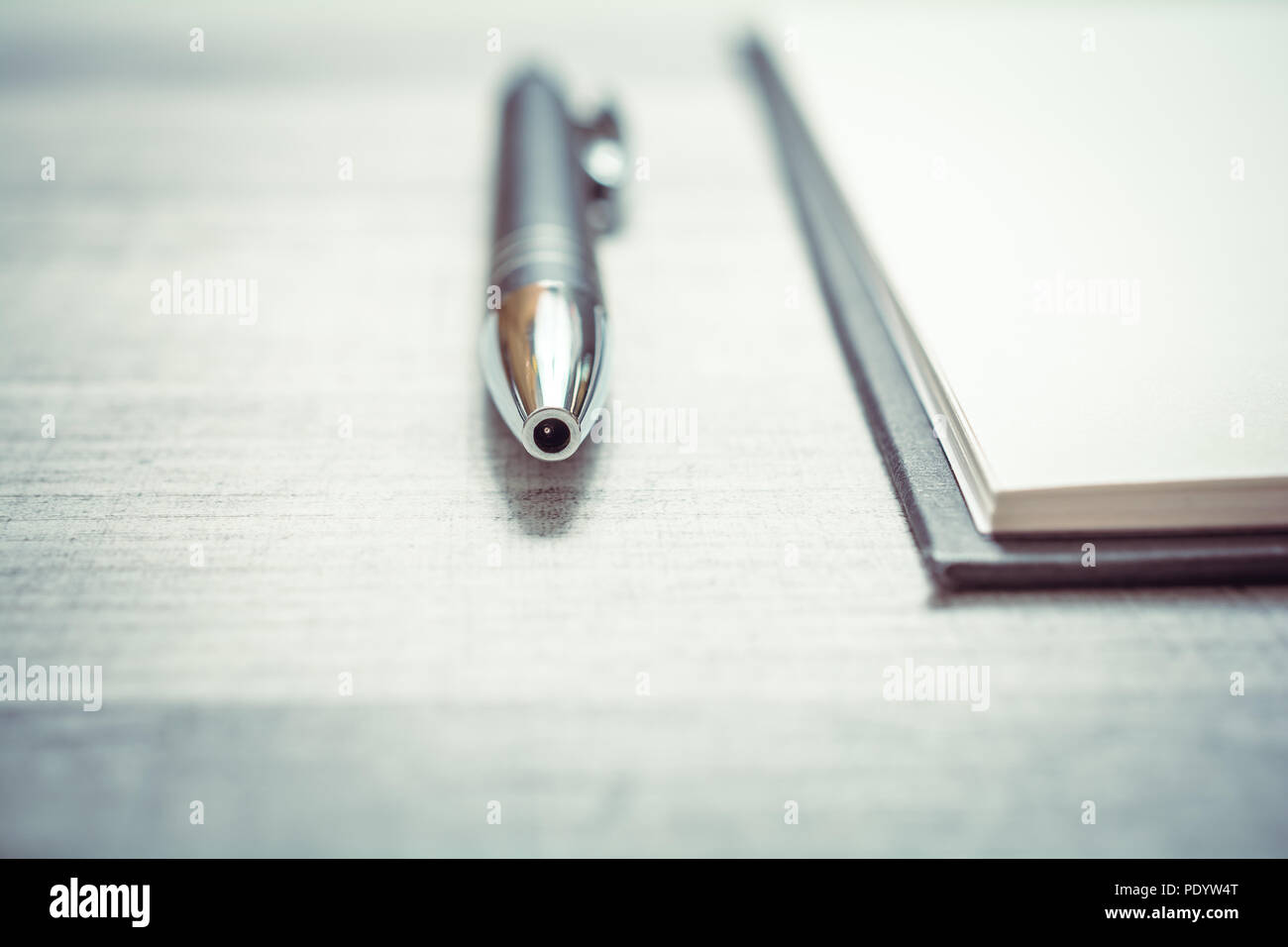 Biro Beside An Empty Notepad On A Table Stock Photo - Alamy