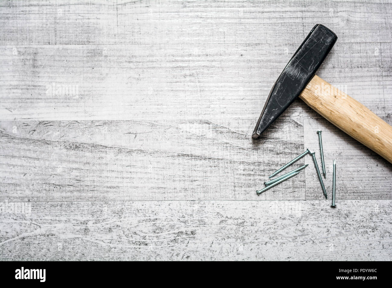 Tool Set Of Hammer And Nails On A Wooden Table - Top Down View With ...